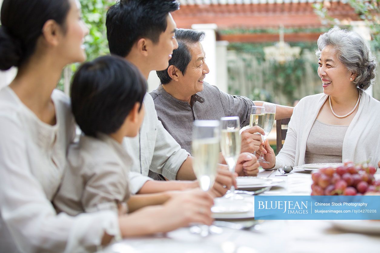 Chinese family eating holiday meal together-High-res stock photo for ...
