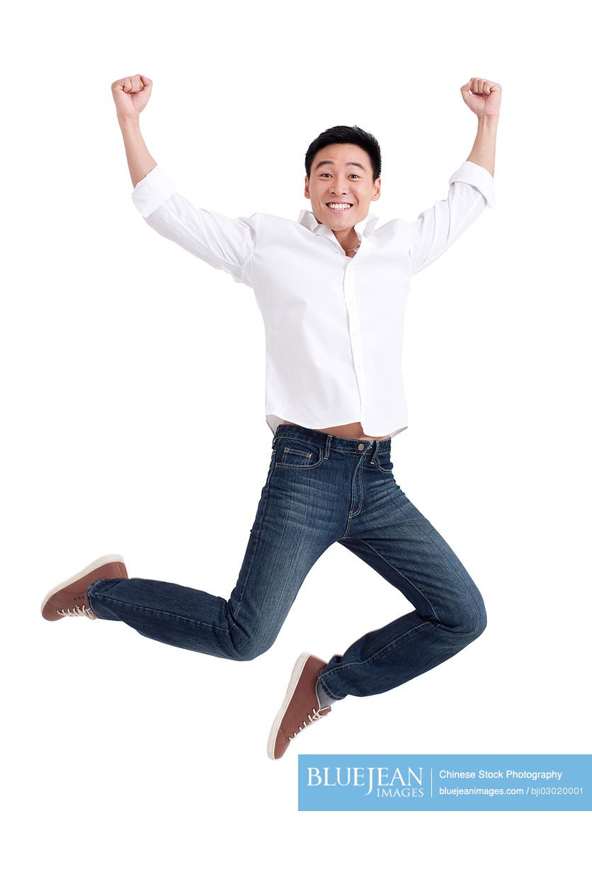 Young Chinese man jumping in mid air-High-res stock photo for download