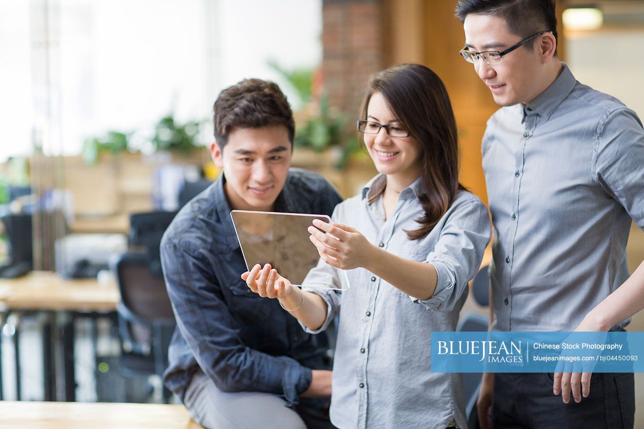 Chinese IT workers developing digital tablet-High-res stock photo for ...