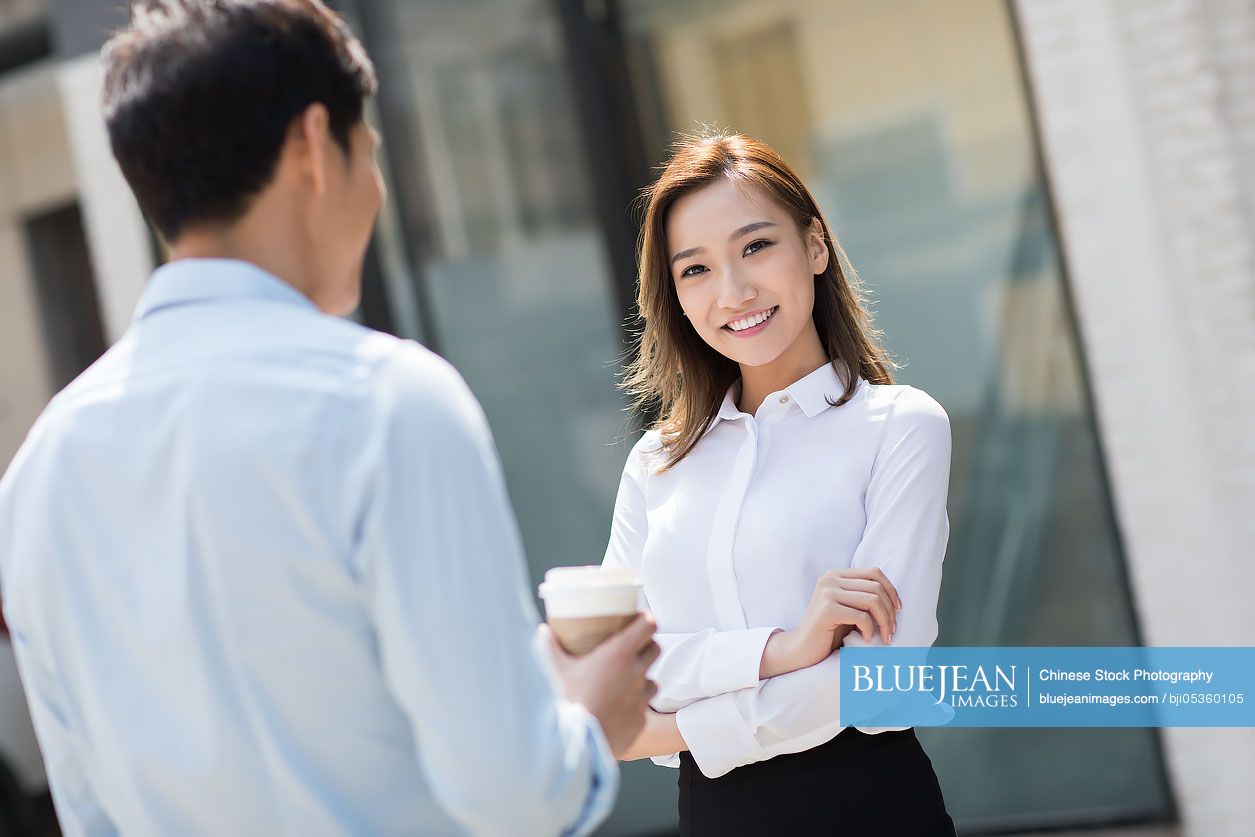 Young Chinese business people chatting outdoors-High-res stock photo ...