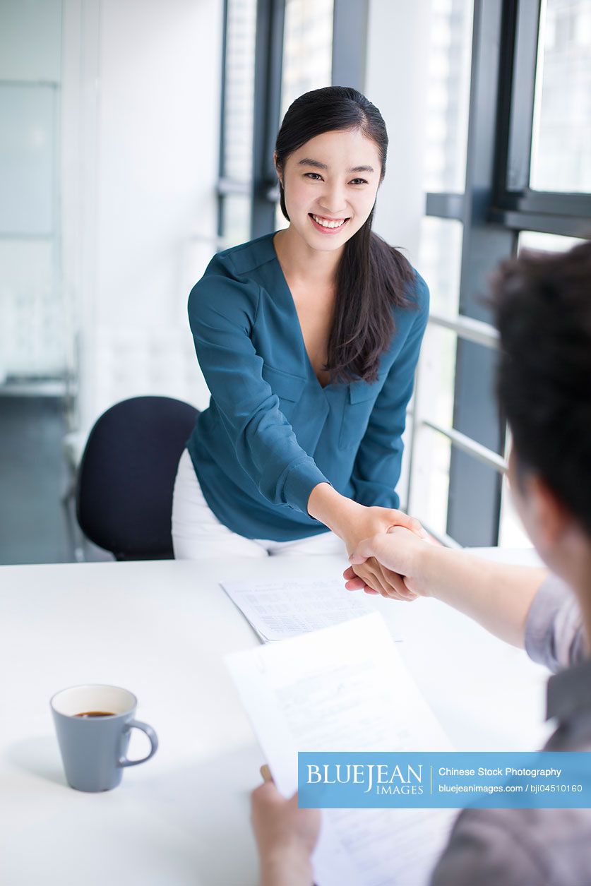 Young Chinese woman interviewing for a job-High-res stock photo for ...