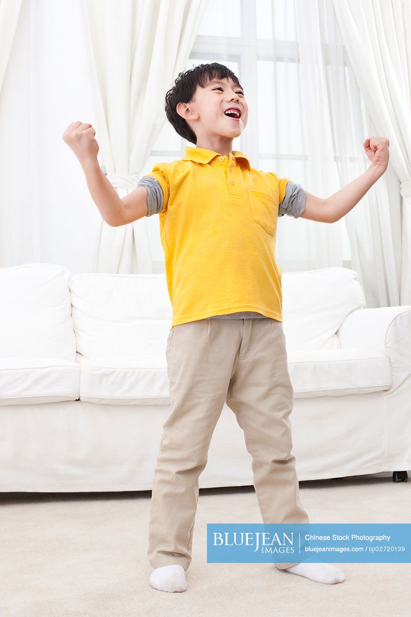 Little Chinese boy showing his strength-High-res stock photo for download