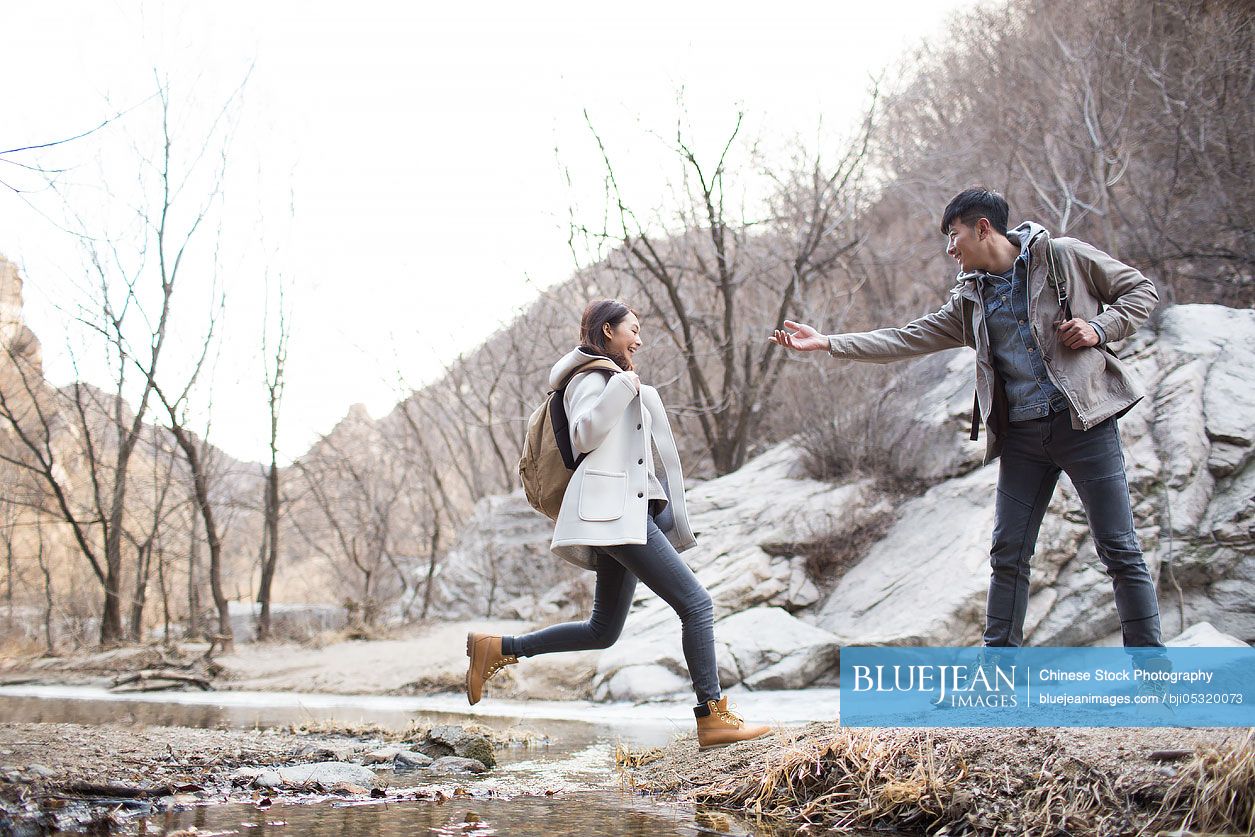 Happy young Chinese couple enjoying winter outing-High-res stock photo for download