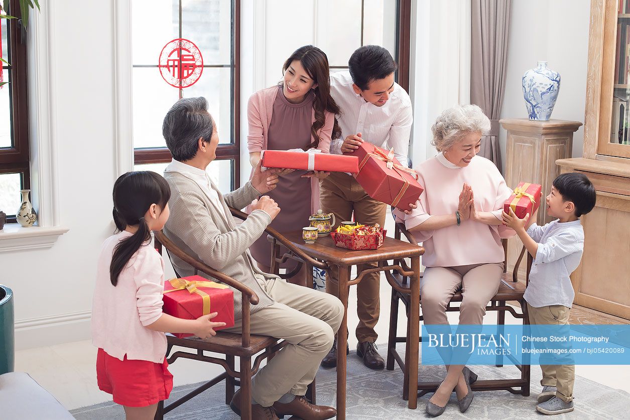 Family visiting with gifts during Chinese New Year-High-res stock photo ...