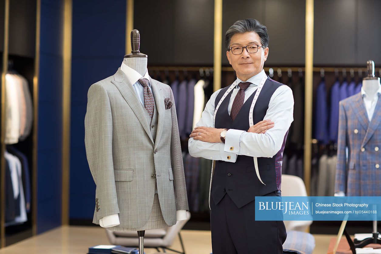 Portrait of confident Chinese fashion designer-High-res stock photo for ...