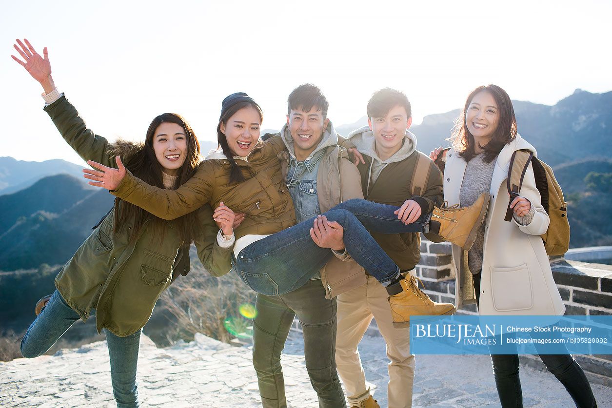 Portrait of happy young Chinese friends on the Great Wall-High-res ...