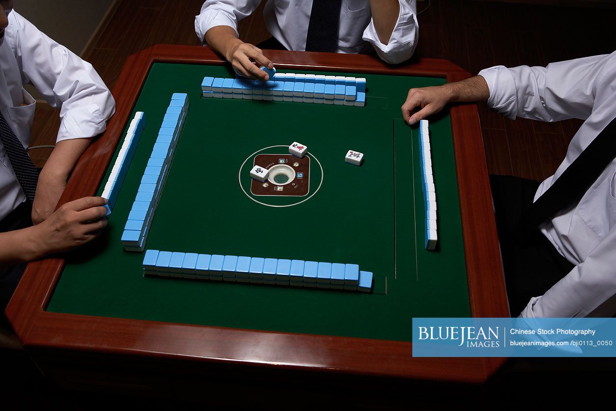 Three businessmen play Mahjong-High-res stock photo for download