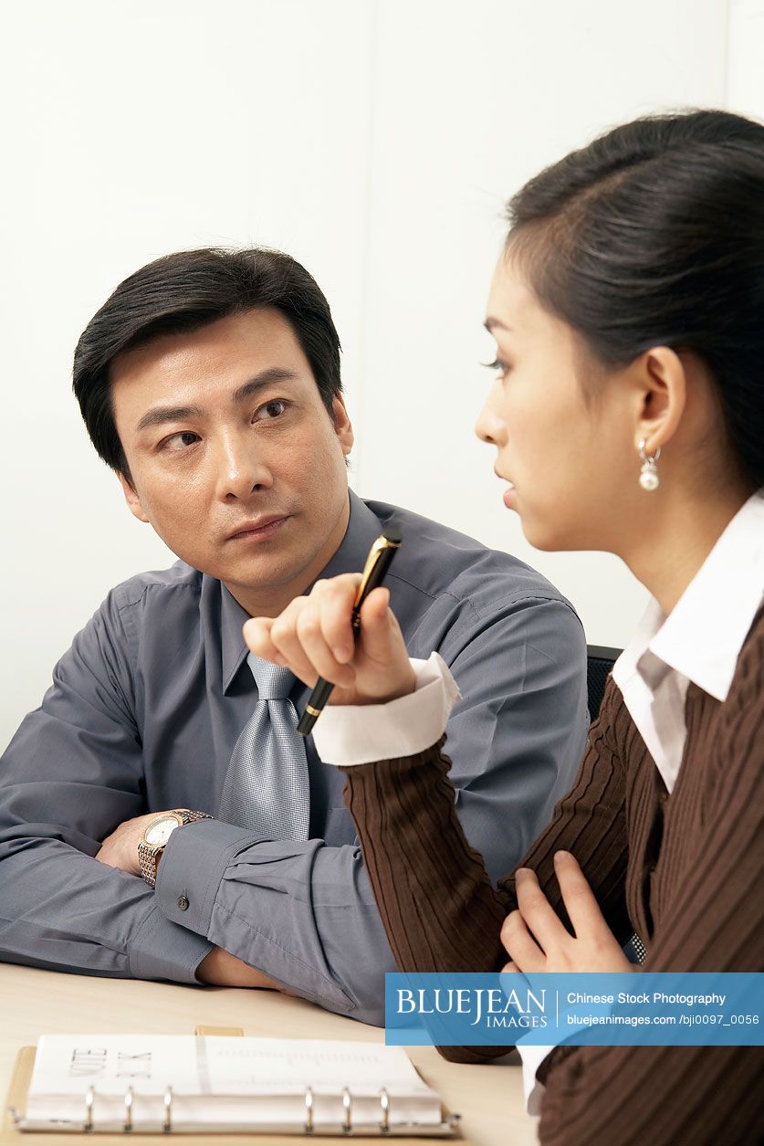 Chinese Businesspeople Having A Discussion In A Board Room-High-res ...