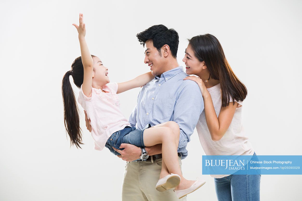 Cheerful young Chinese family-High-res stock photo for download