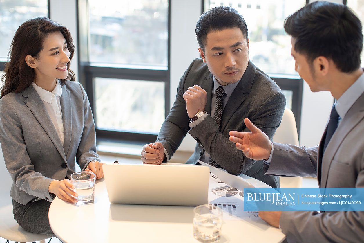 Successful Chinese business people talking in office-High-res stock ...