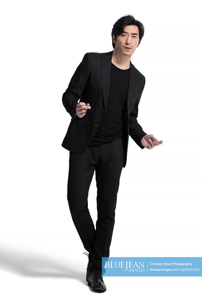 Fashionable mid adult Chinese man dancing-High-res stock photo for download