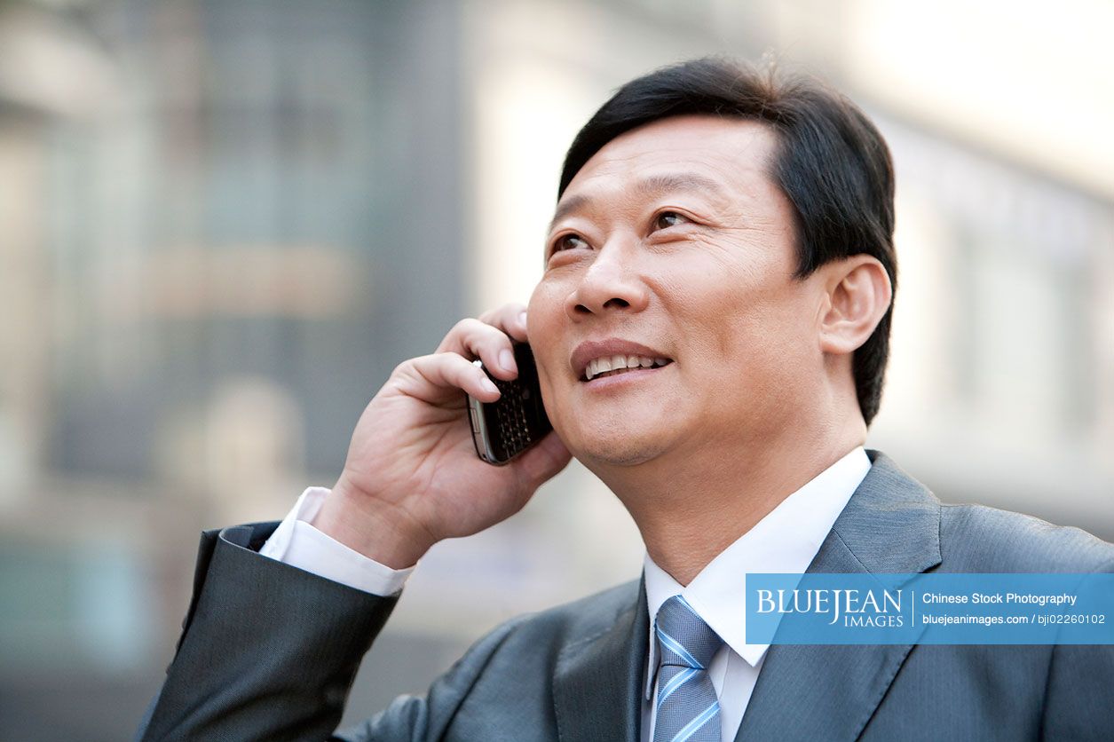 Portrait of a happy Chinese businessman-High-res stock photo for download