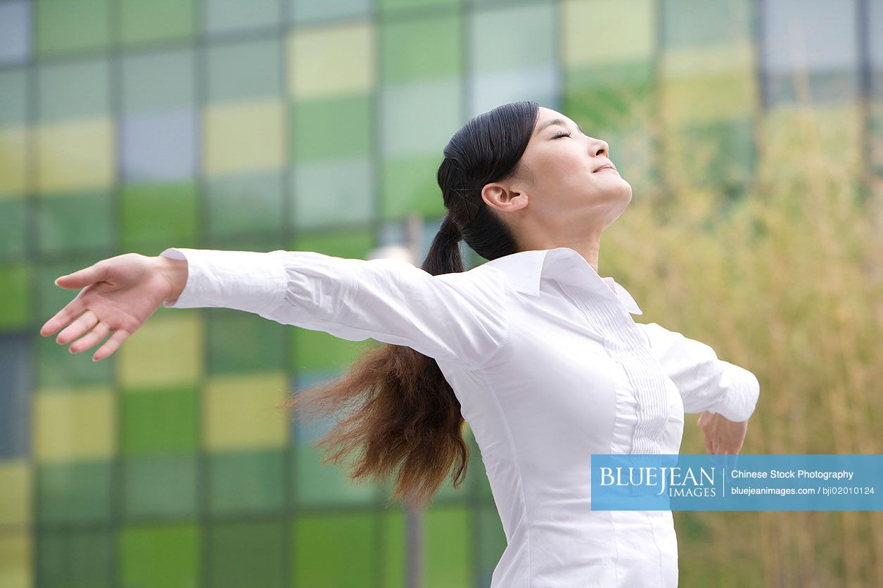 Chinese businesswoman feeling the moment-High-res stock photo for download