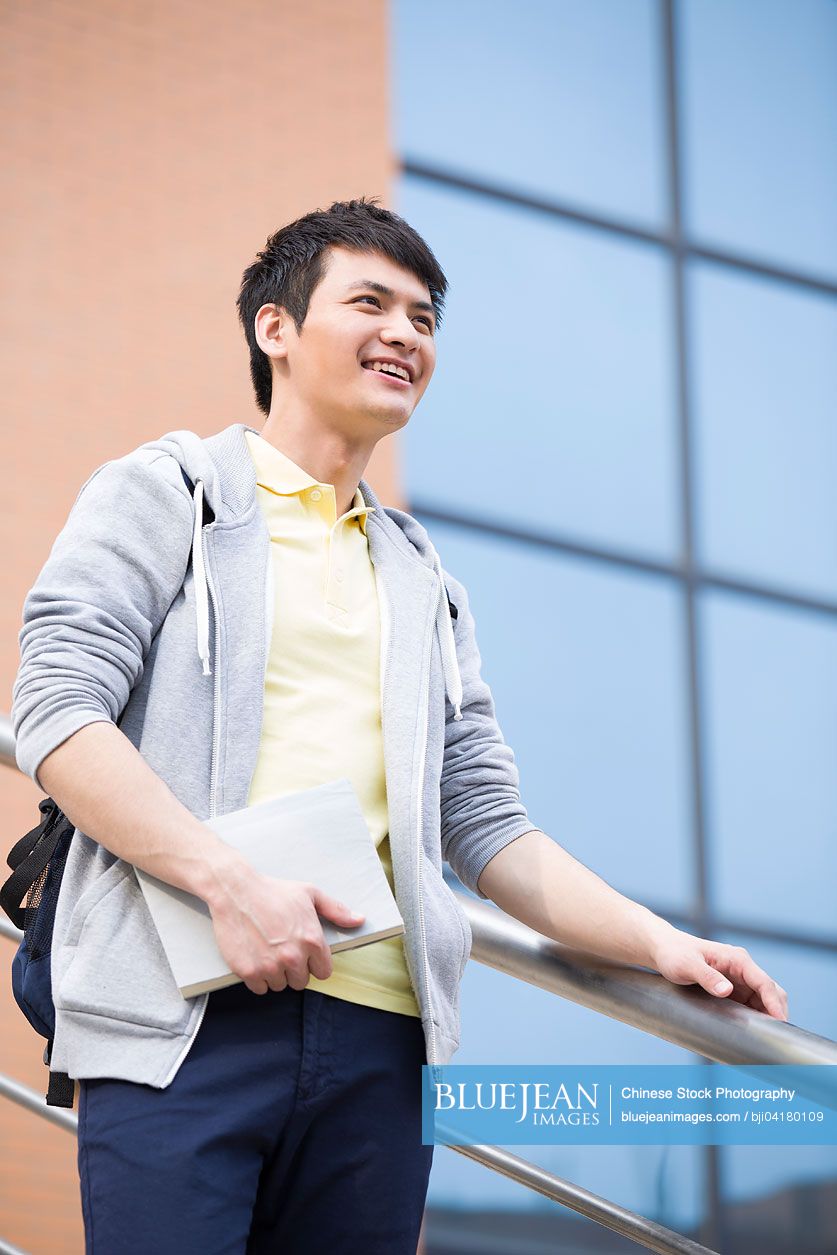 Male Chinese college student outside library-High-res stock photo for ...