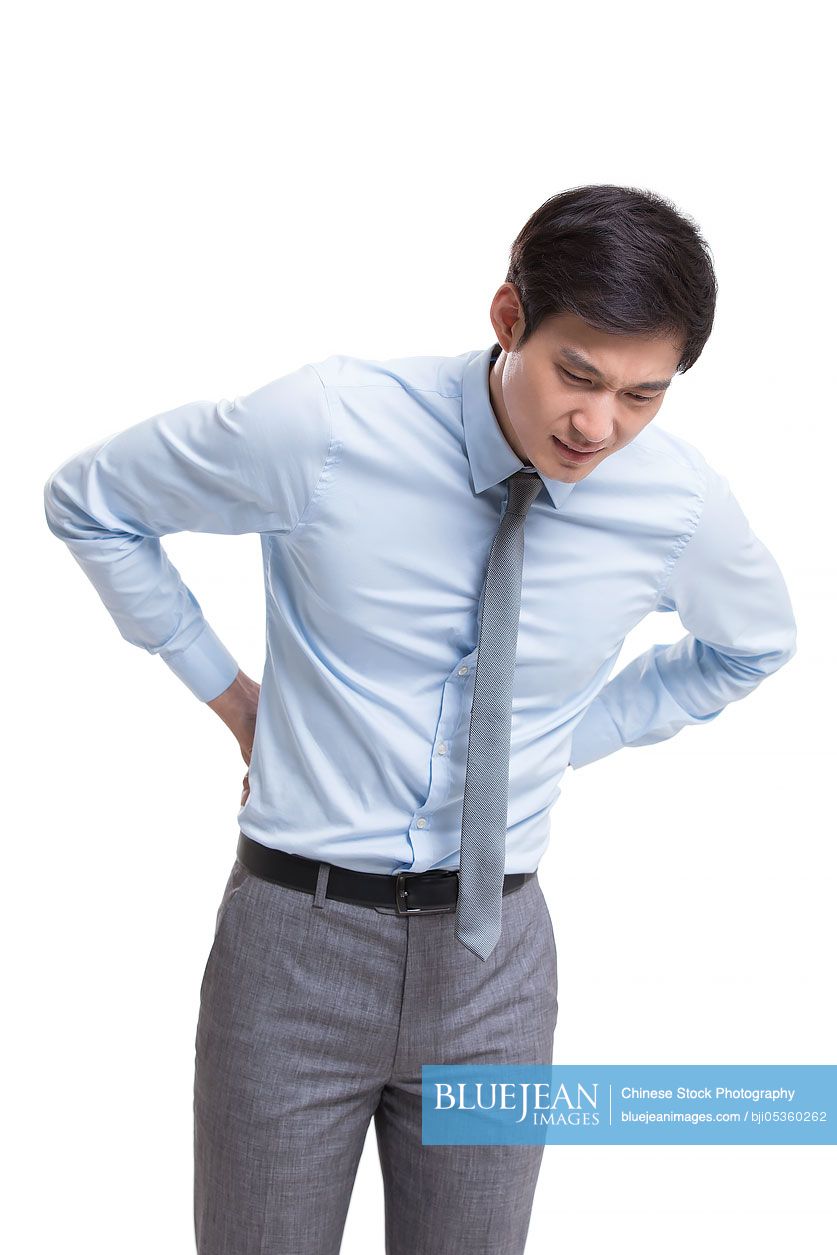 Young Chinese businessman suffering from backache-High-res stock photo ...