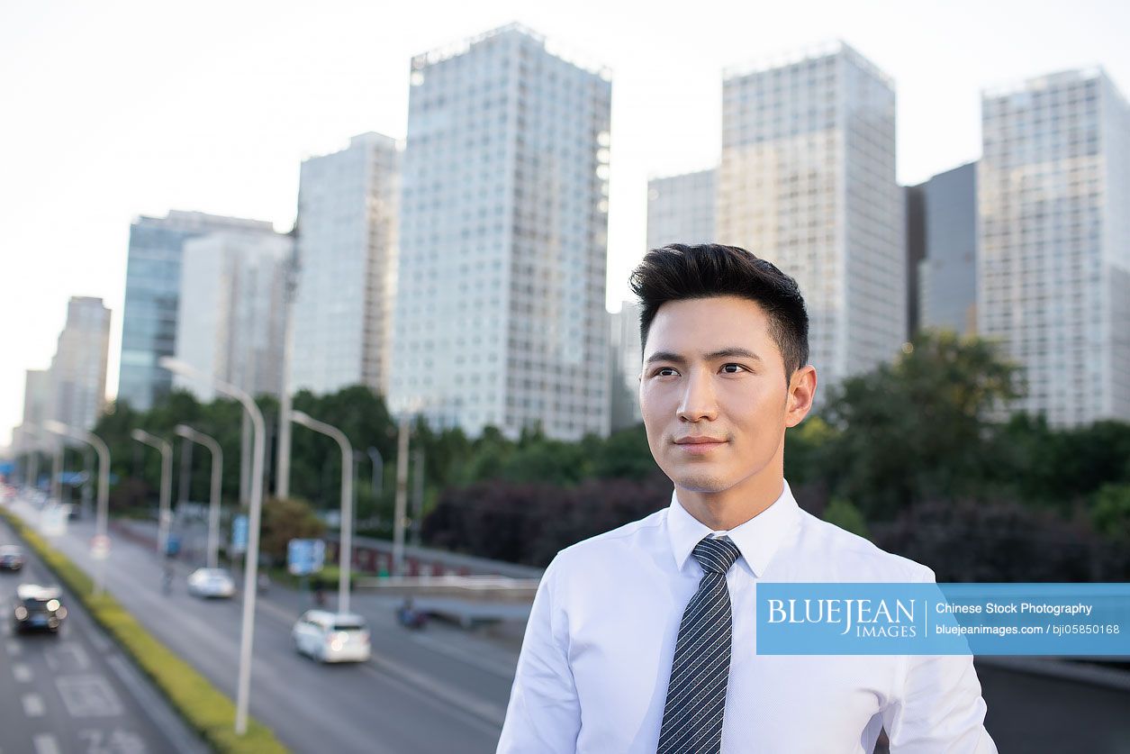 Confident young Chinese businessman -High-res stock photo for download