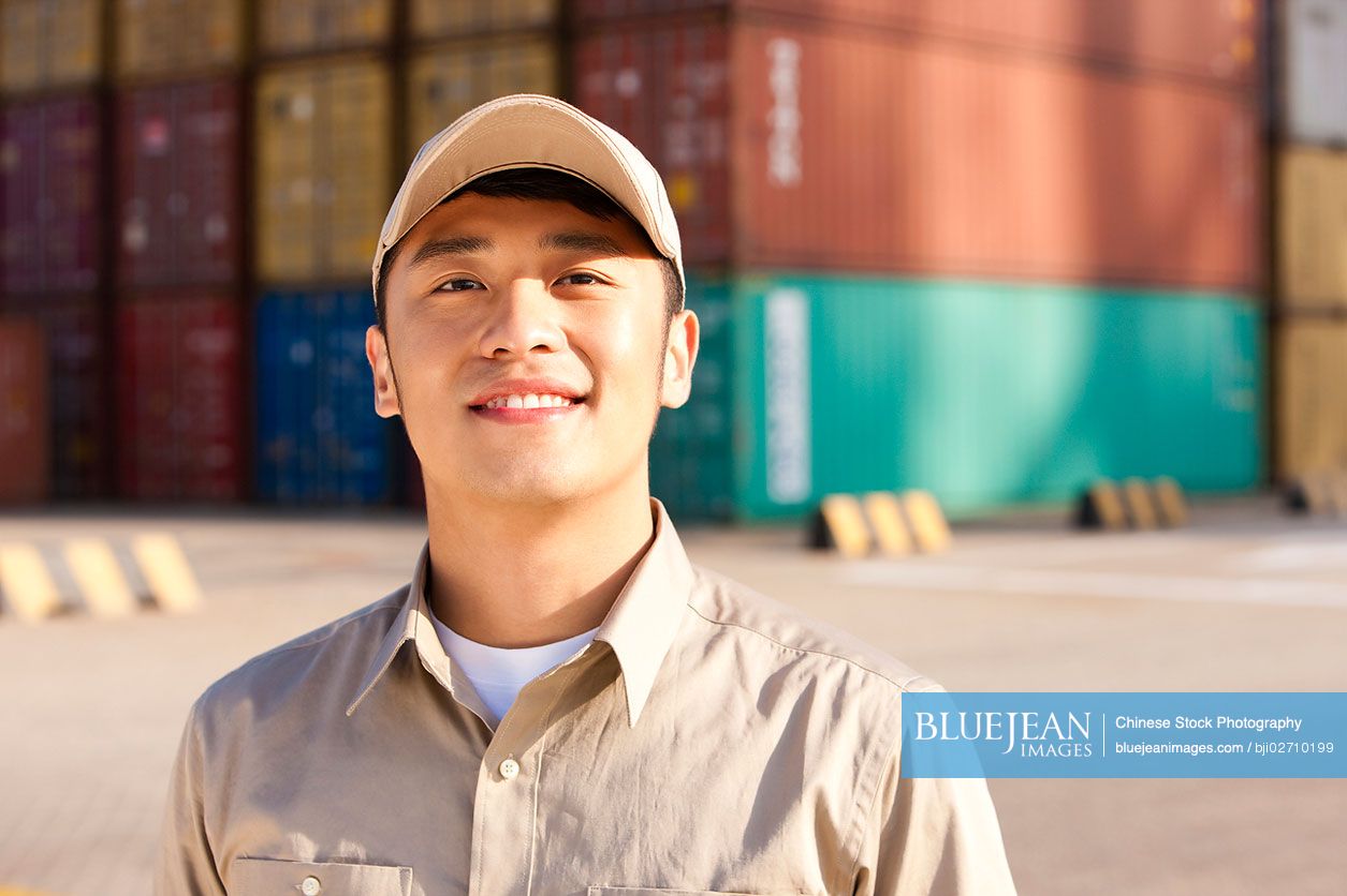 Chinese shipping industry worker contemplating-High-res stock photo for ...