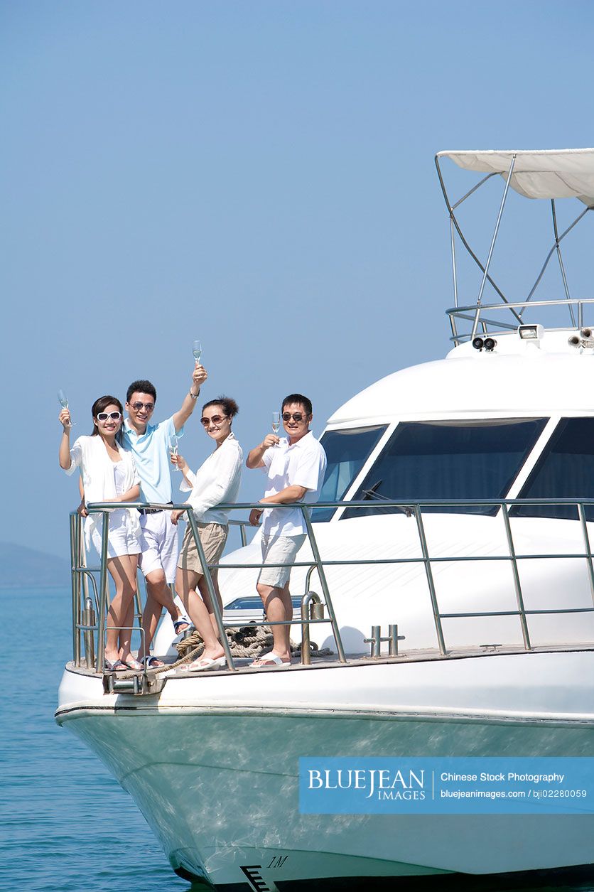 Chinese Friends Toasting Champagne On A Yacht High res Stock Photo For chinese-friends-toasting-champagne-on-a-yacht-high-res-stock-photo-for