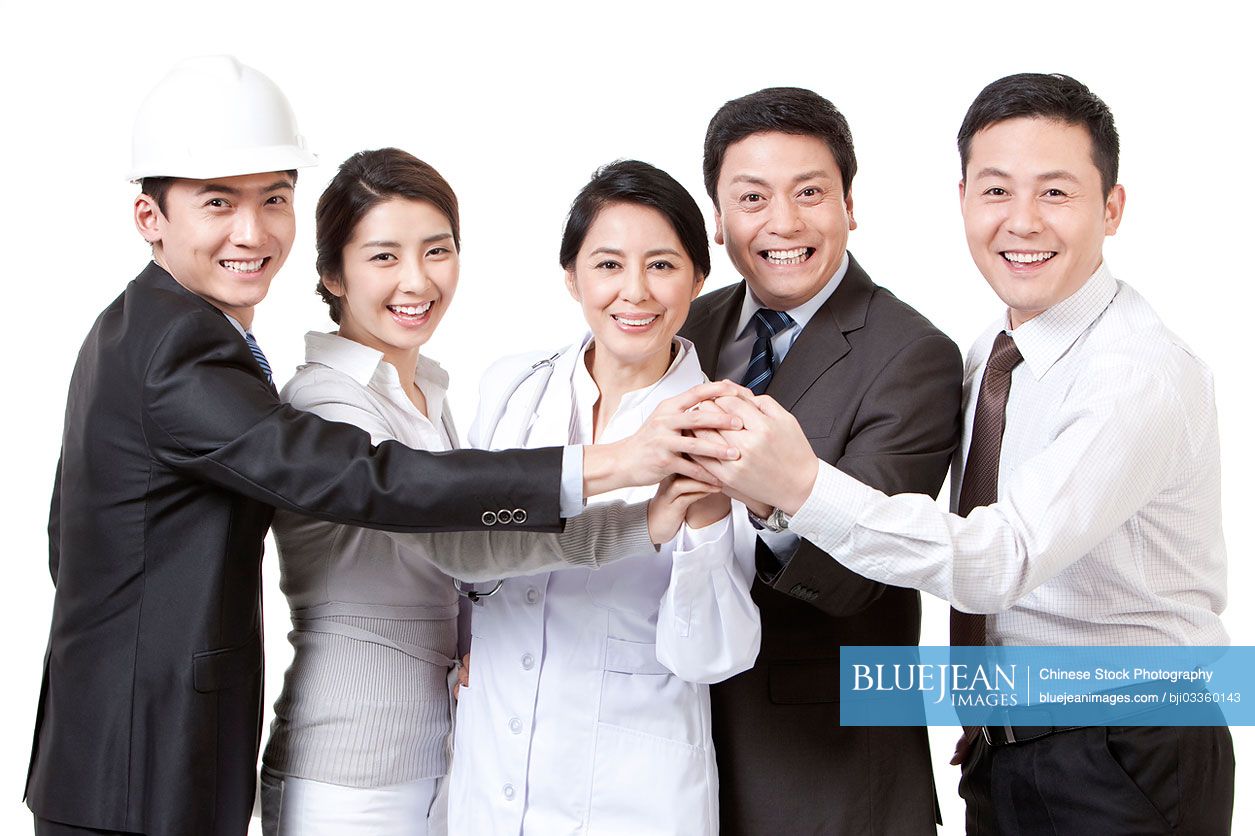 Confident Chinese workers in different occupations shaking hands-High ...