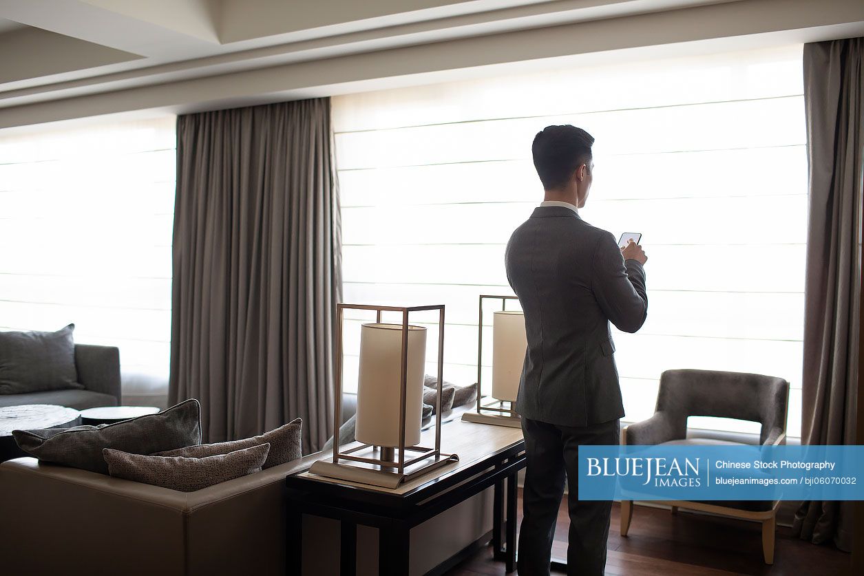 Young Chinese businessman and smart home-High-res stock photo for download