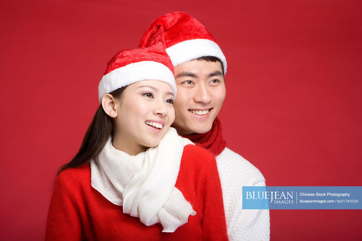 Young Chinese couple celebrating Christmas-High-res stock photo for ...