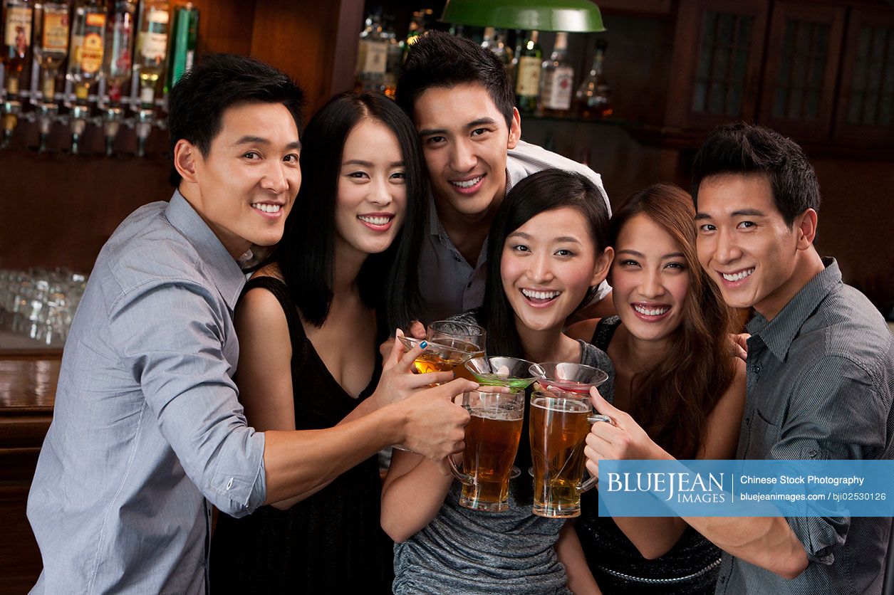 Chinese friends relaxing at a bar-High-res stock photo for download