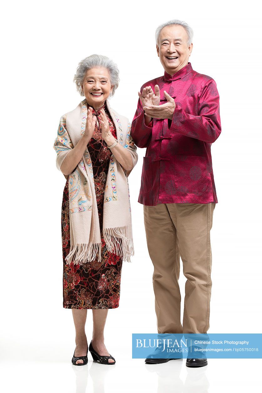 Happy senior Chinese couple clapping hands-High-res stock photo for download