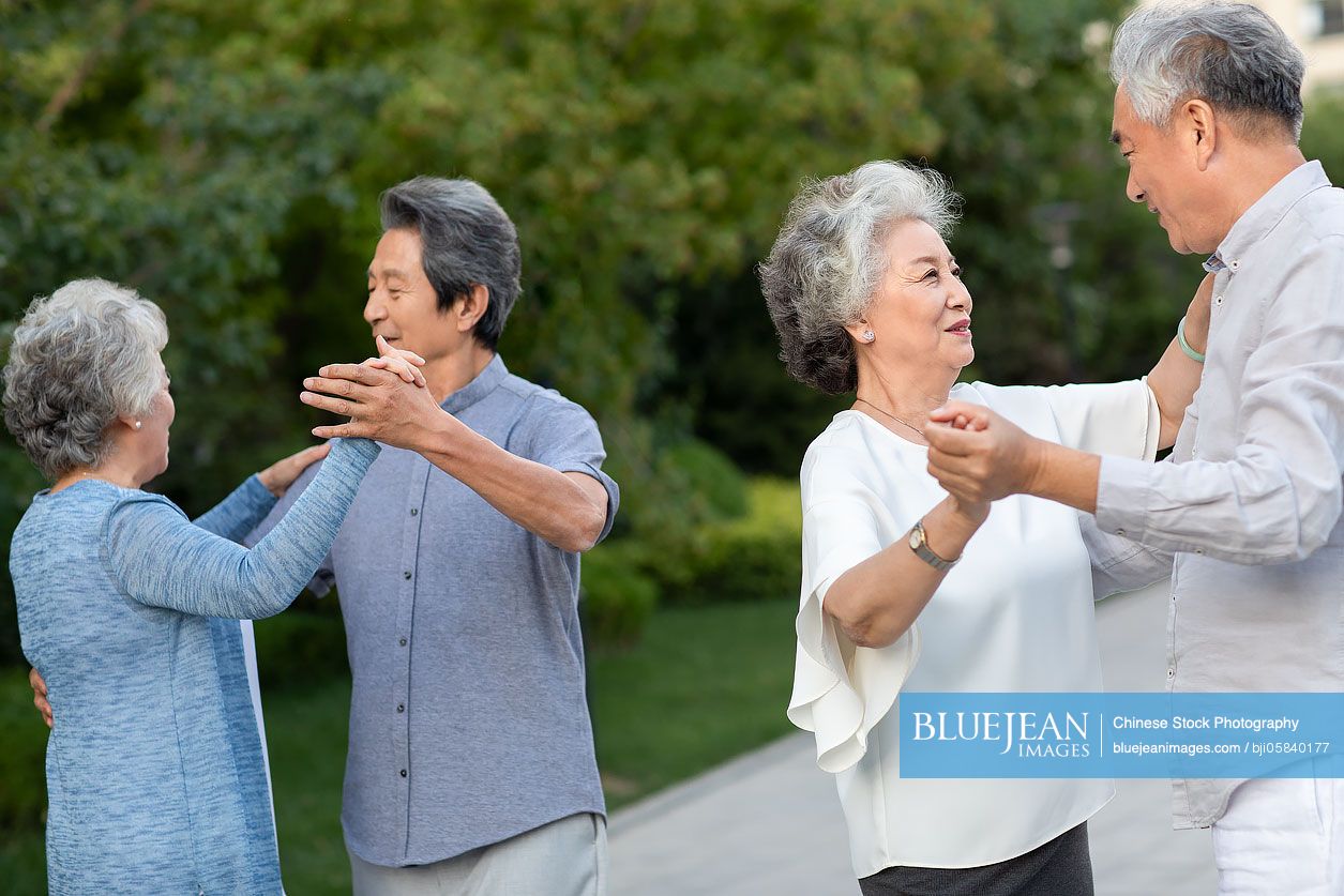 Happy senior Chinese couple dancing in park-High-res stock photo for ...