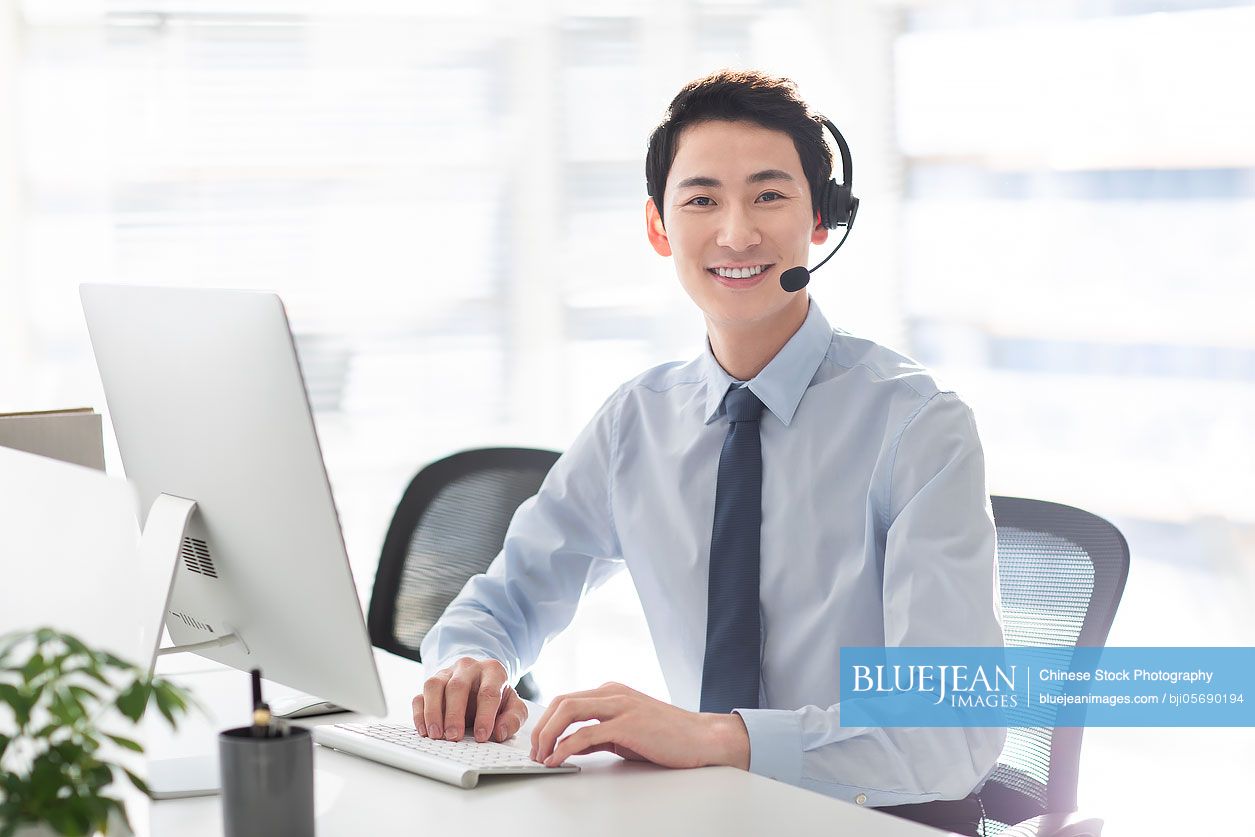 Young Chinese businessman working in office-High-res stock photo for download