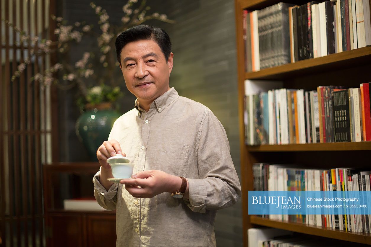 Mature Chinese man drinking tea-High-res stock photo for download