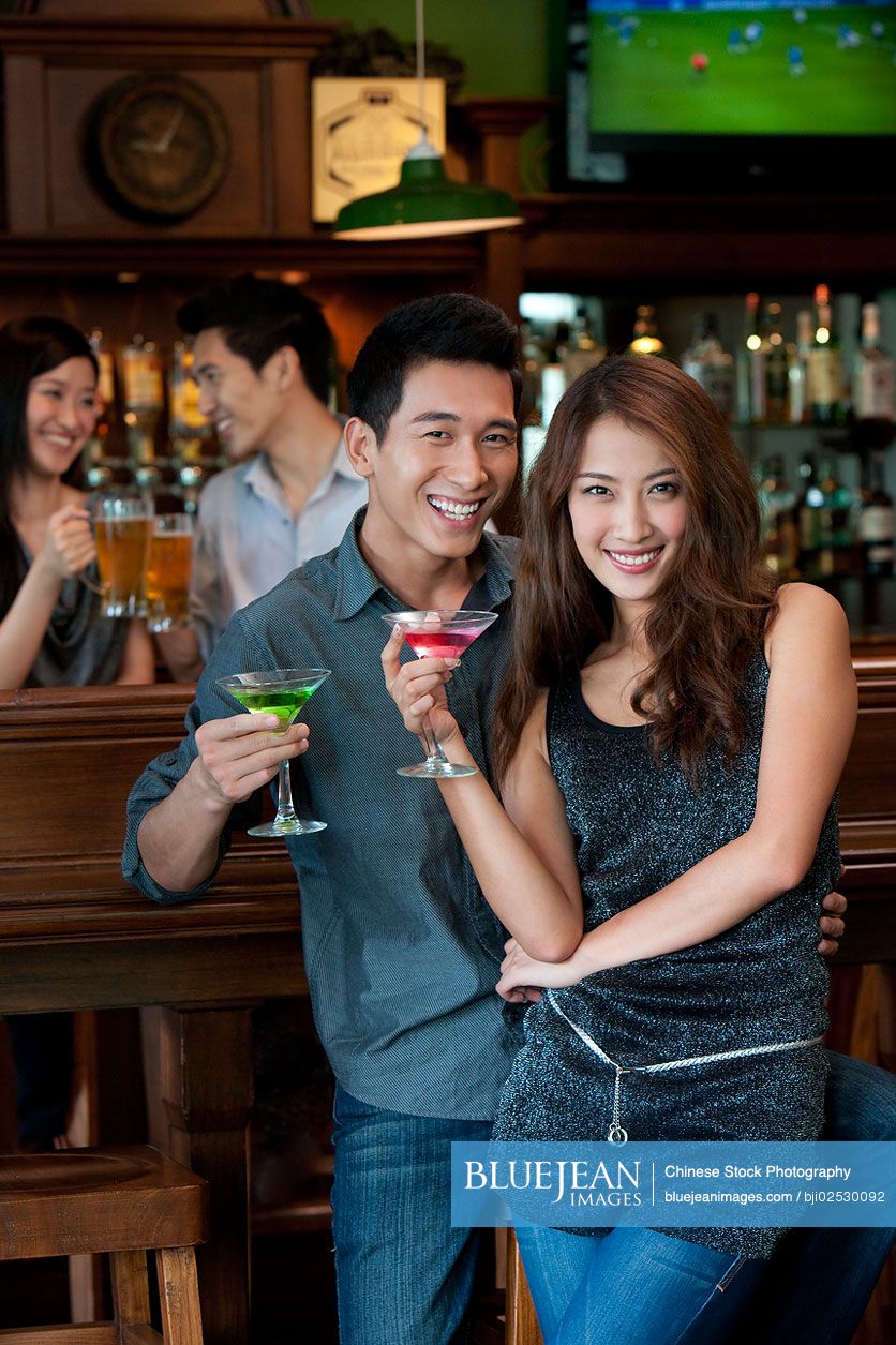 Chinese couple enjoying cocktails together-High-res stock photo for ...
