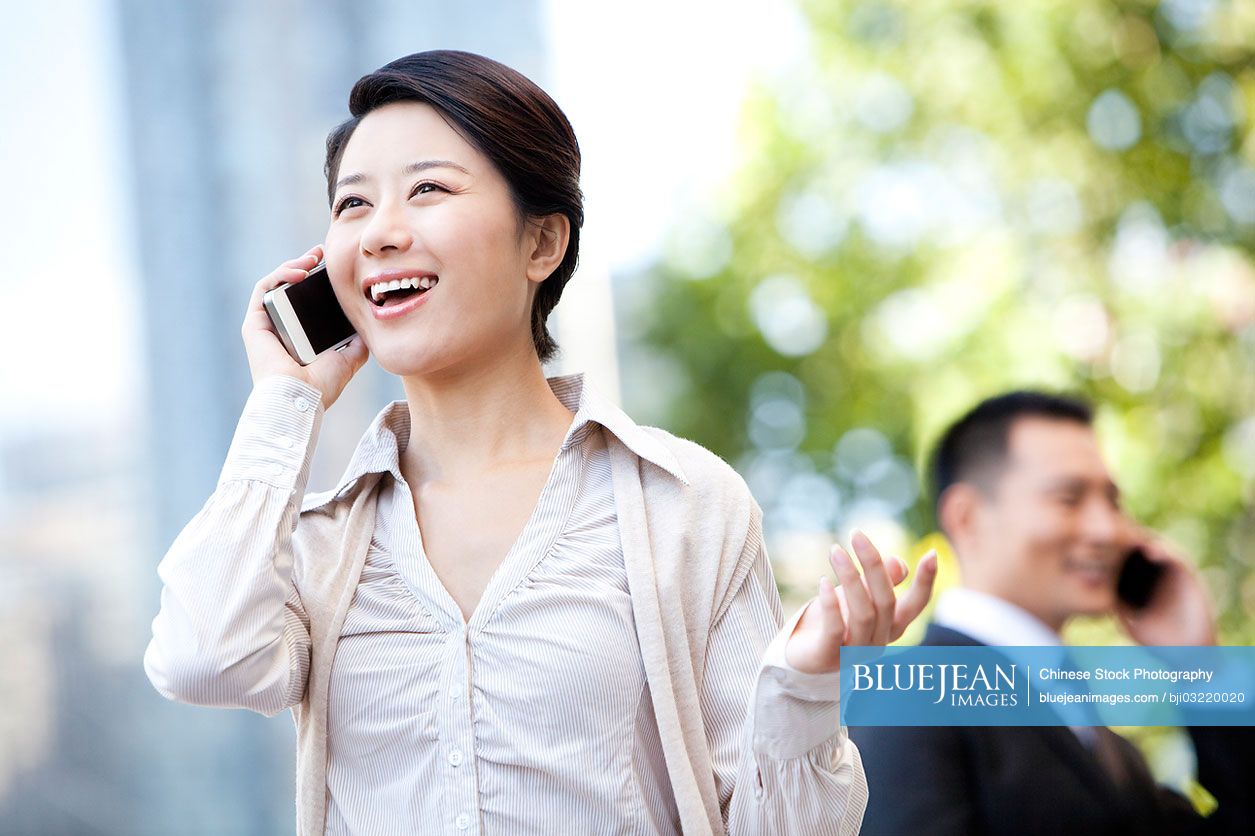 Chinese office workers on the phone outdoors-High-res stock photo for ...