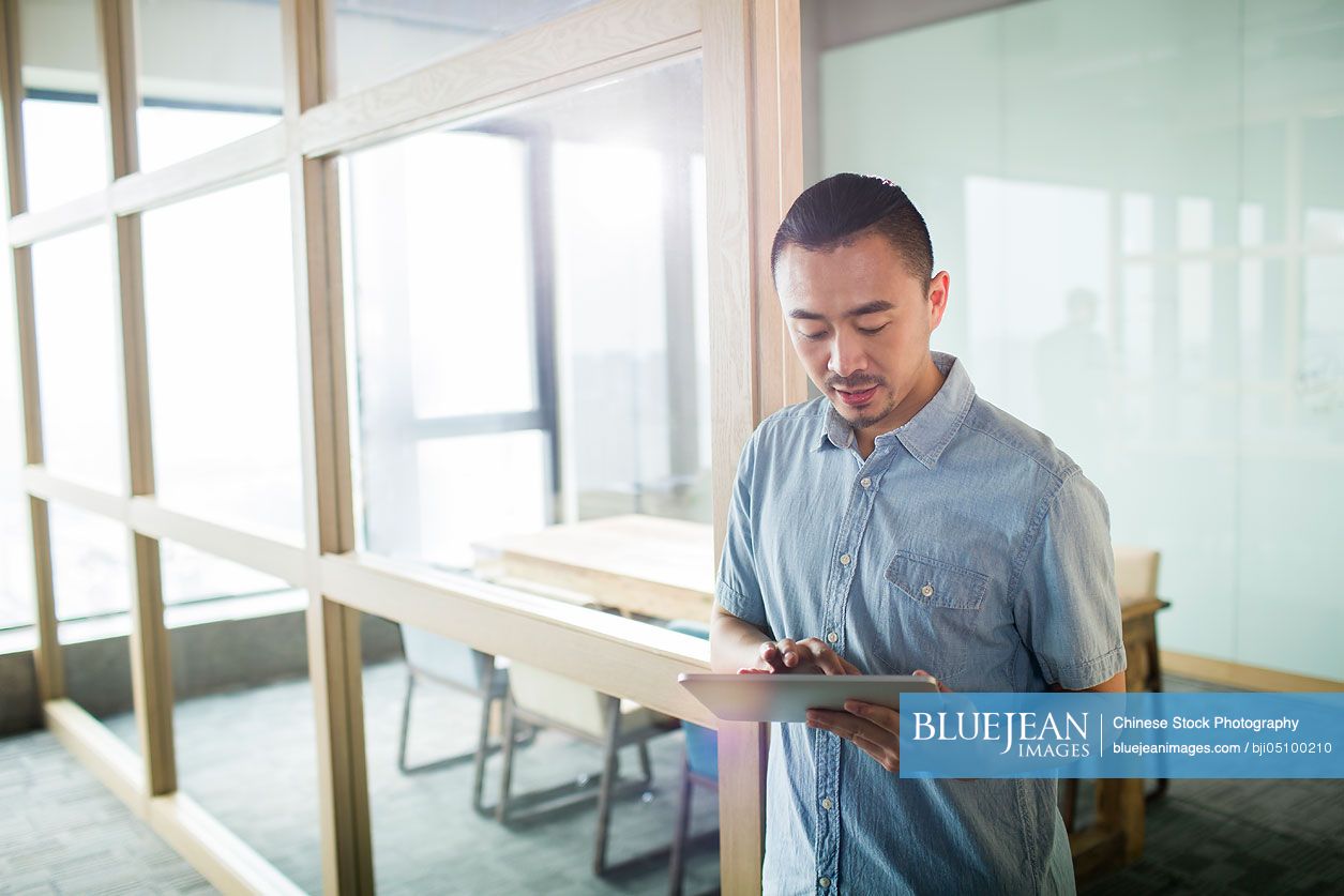 Chinese designer using digital tablet-High-res stock photo for download