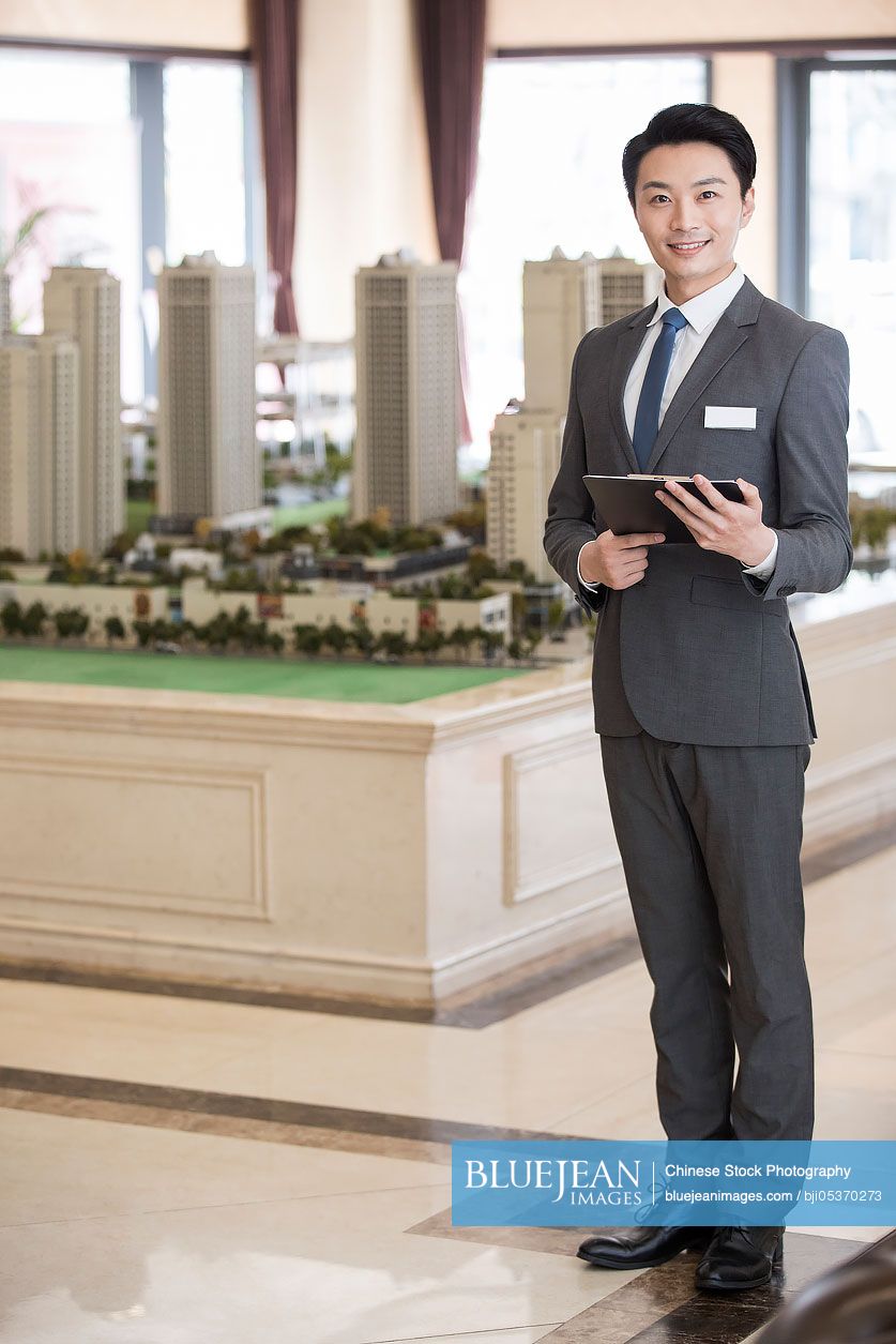 Portrait of confident Chinese male realtor-High-res stock photo for ...