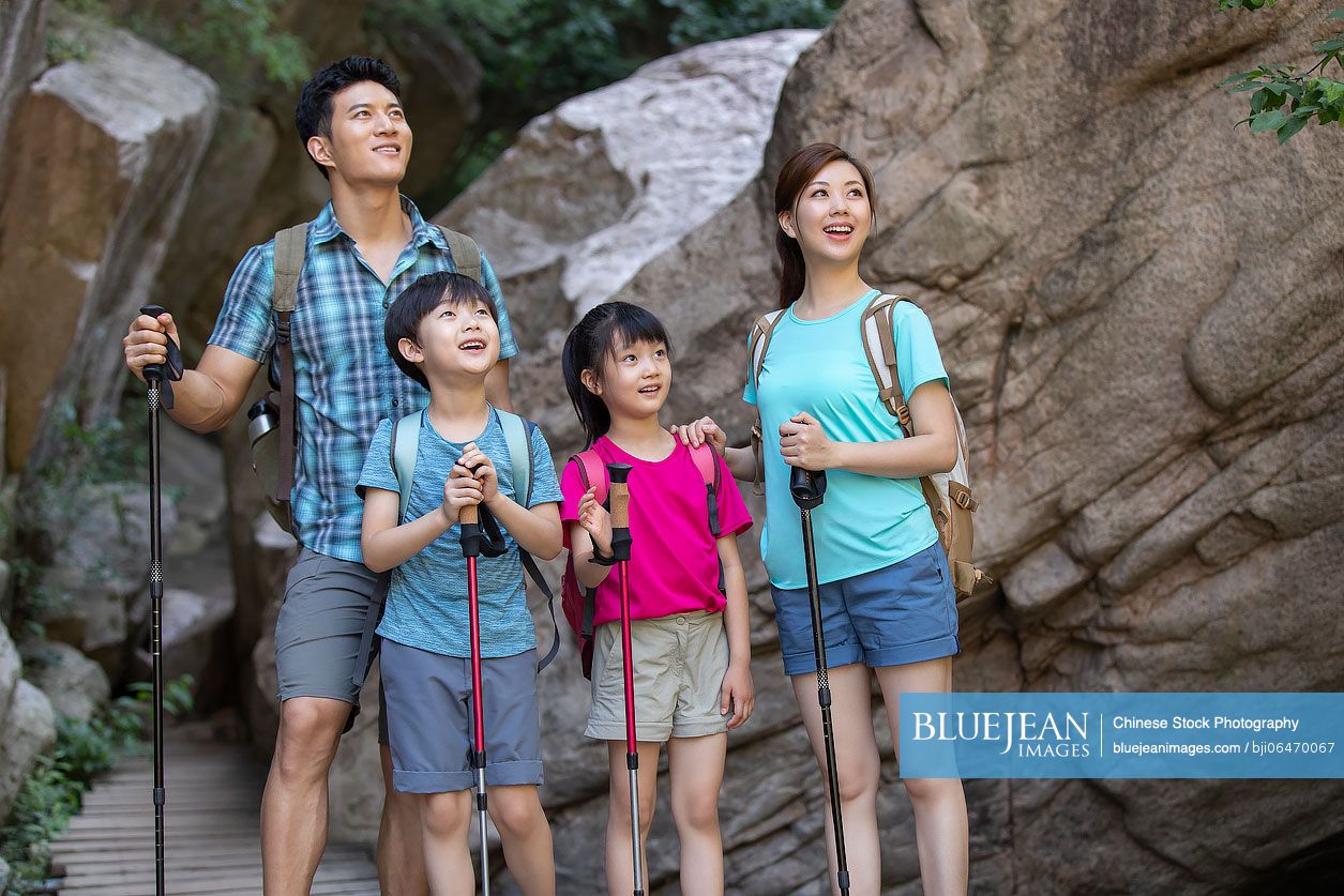 Happy young Chinese family hiking outdoors-High-res stock photo for ...