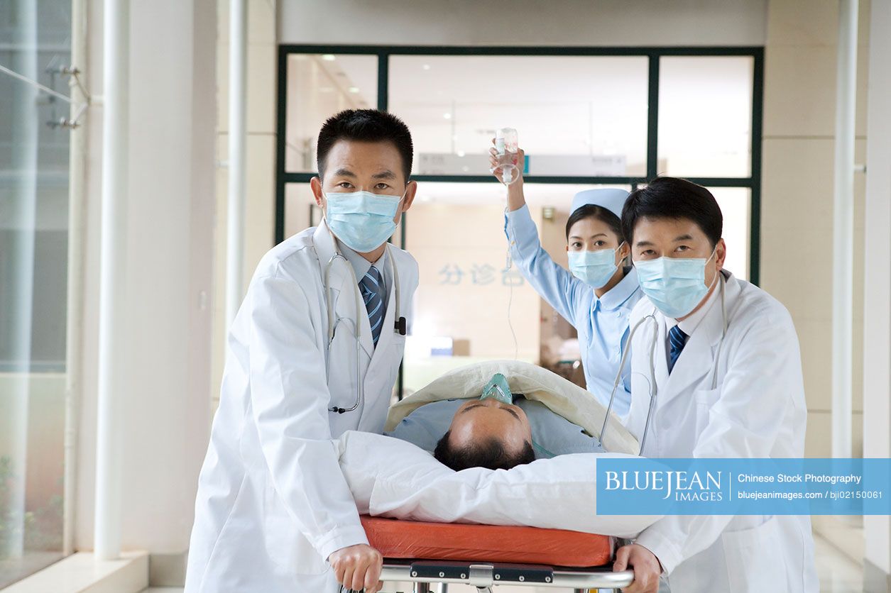Chinese medic team transporting a patient on a stretcher-High-res stock ...