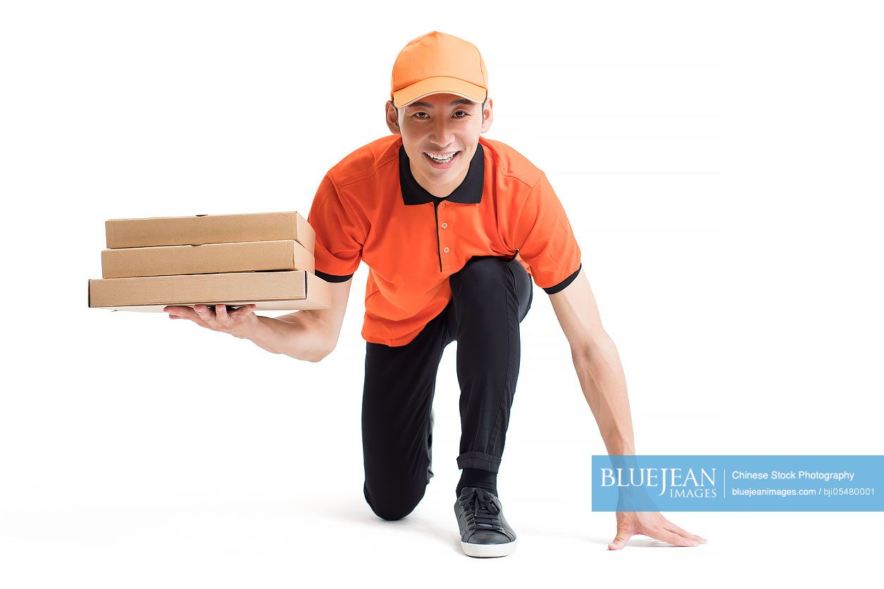 Cheerful Chinese Pizza Delivery Person High res Stock Photo For Download cheerful-chinese-pizza-delivery-person-high-res-stock-photo-for-download