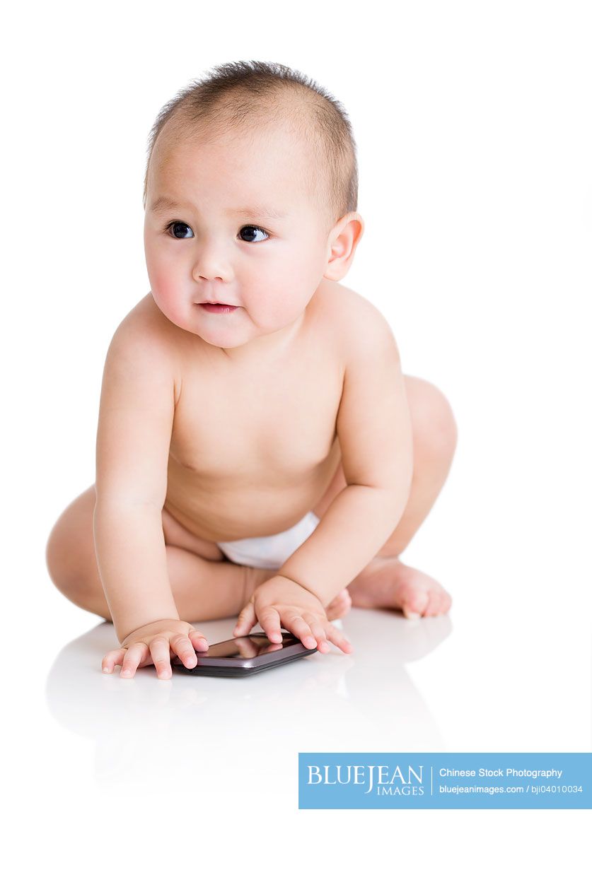 Cute Chinese baby boy with mobile phone-High-res stock photo for download