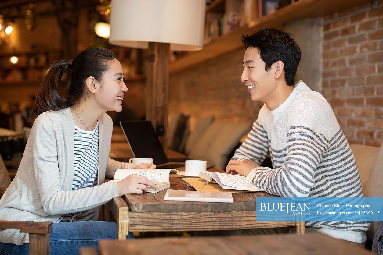 Young Chinese university students studying in coffee shop-High-res ...