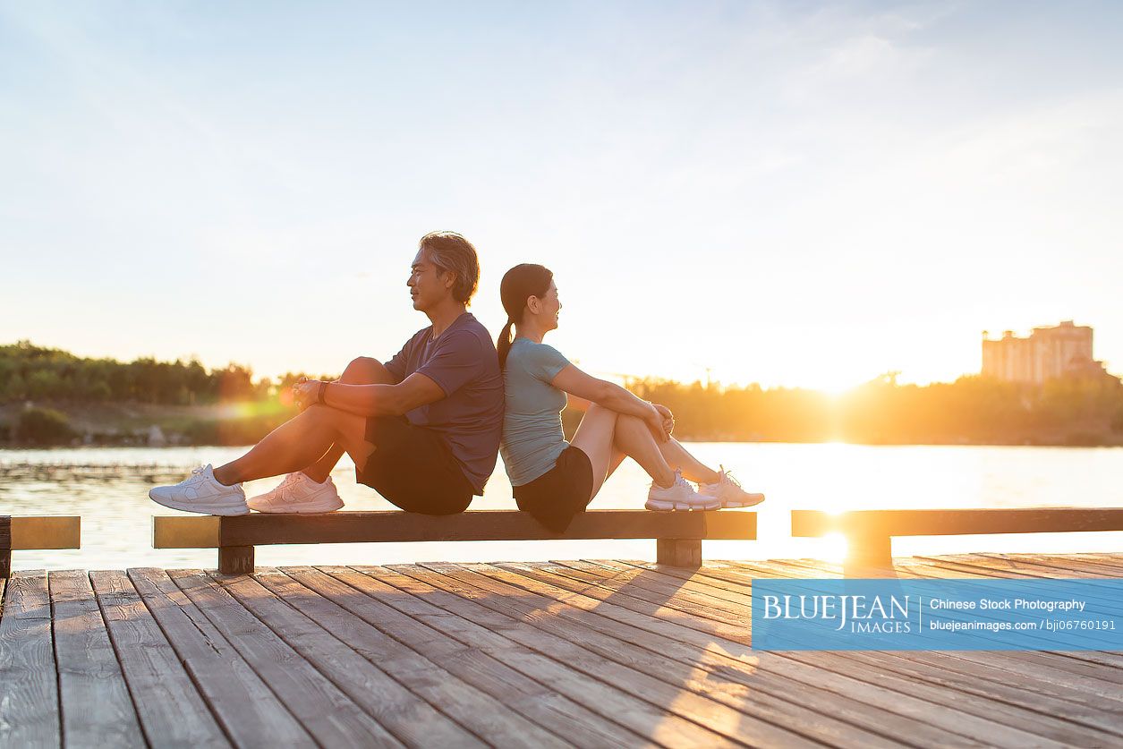 Happy mature Chinese couple relaxing in park-High-res stock photo for download