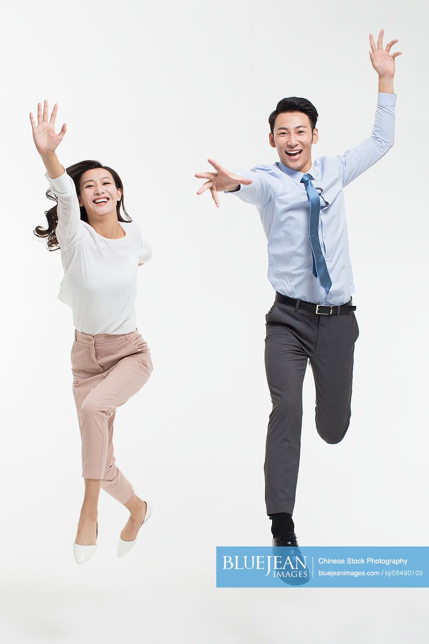 Cheerful young Chinese business people jumping-High-res stock photo for ...