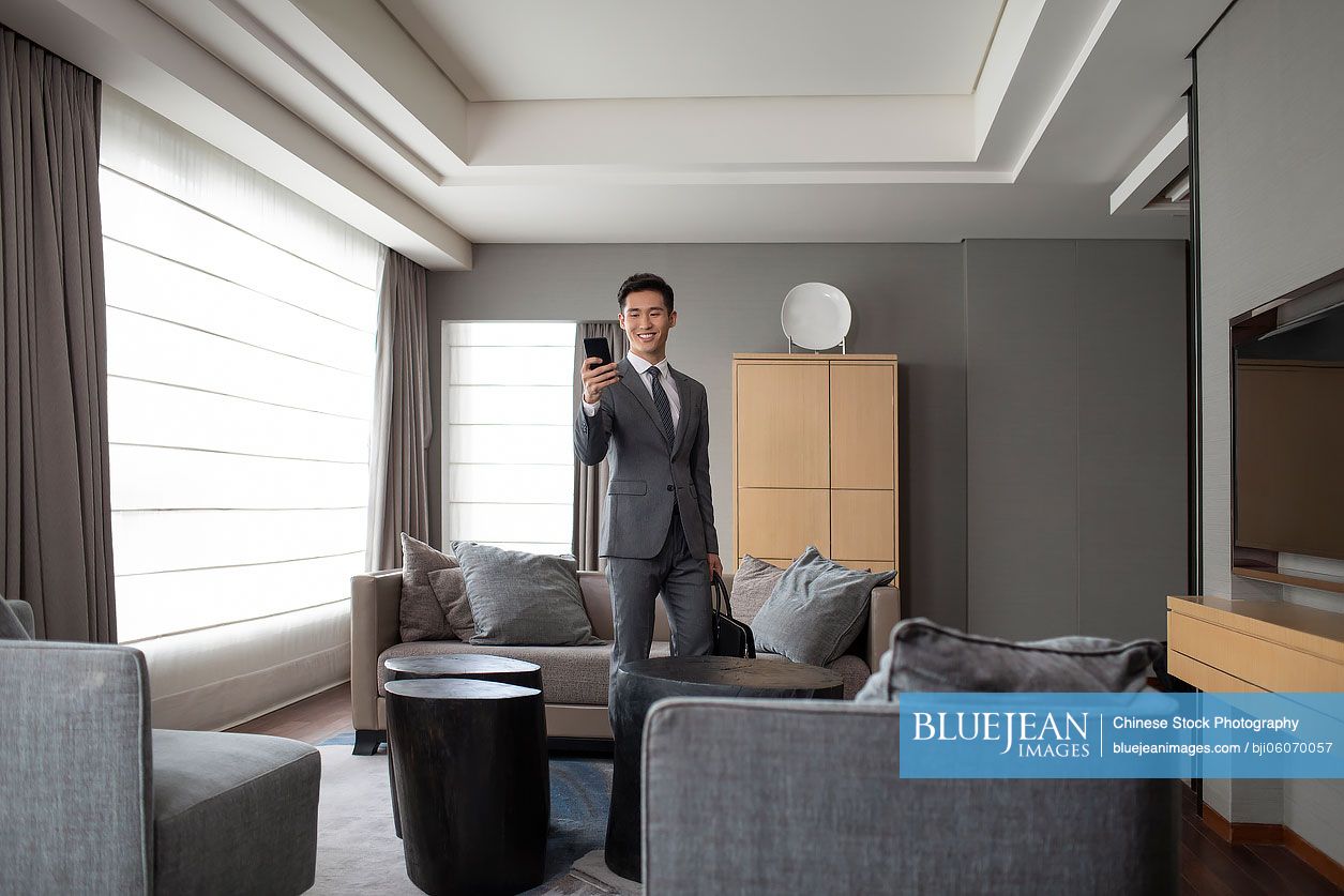 Young Chinese businessman and smart home-High-res stock photo for download