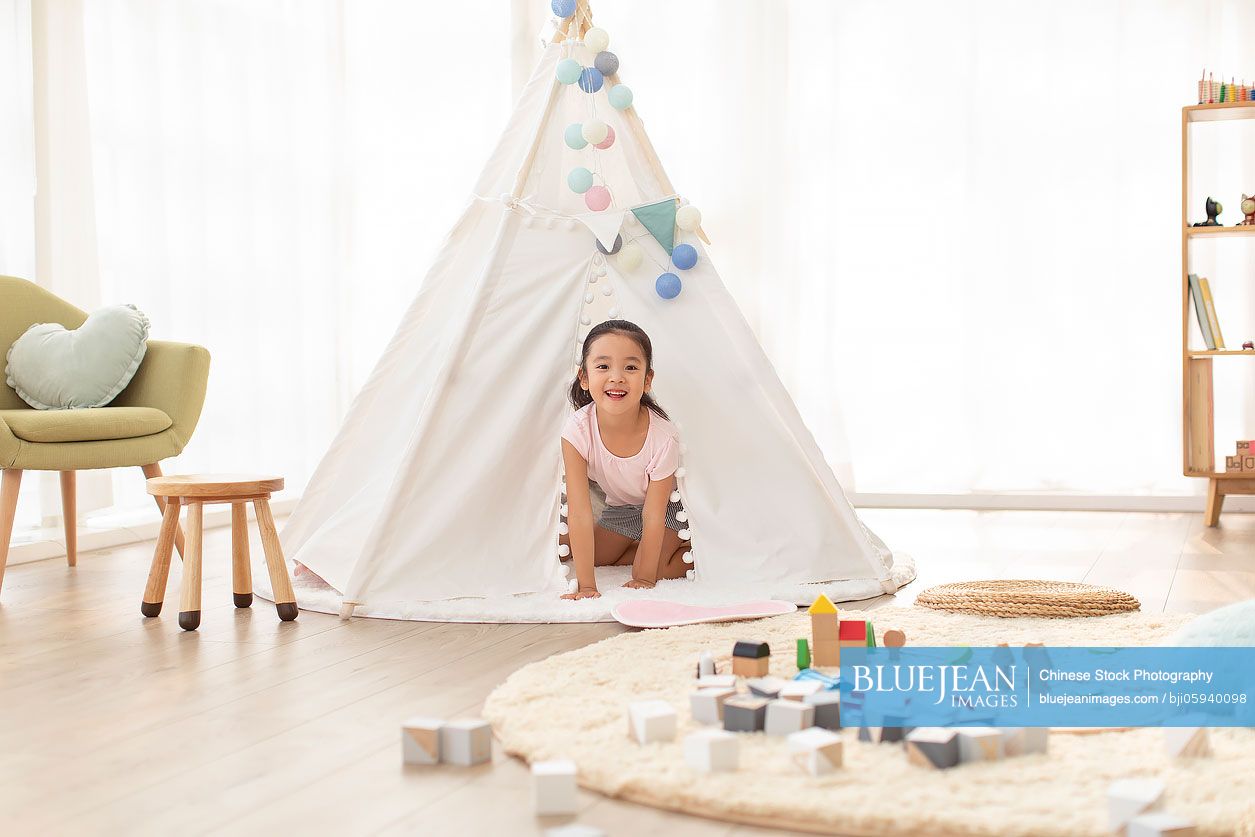 cute-chinese-girl-playing-in-tent-high-res-stock-photo-for-download