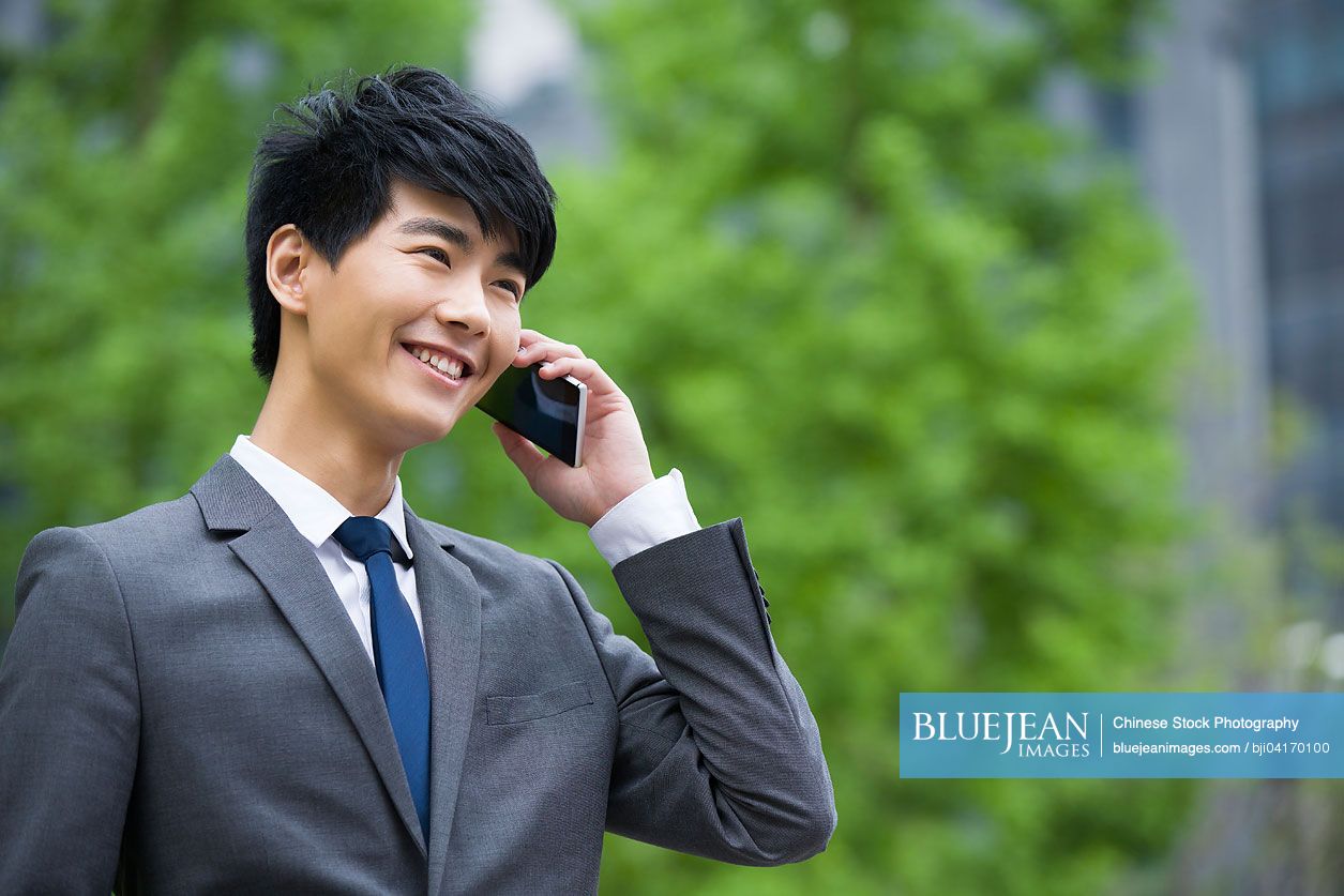 Young Chinese businessman on the phone-High-res stock photo for download