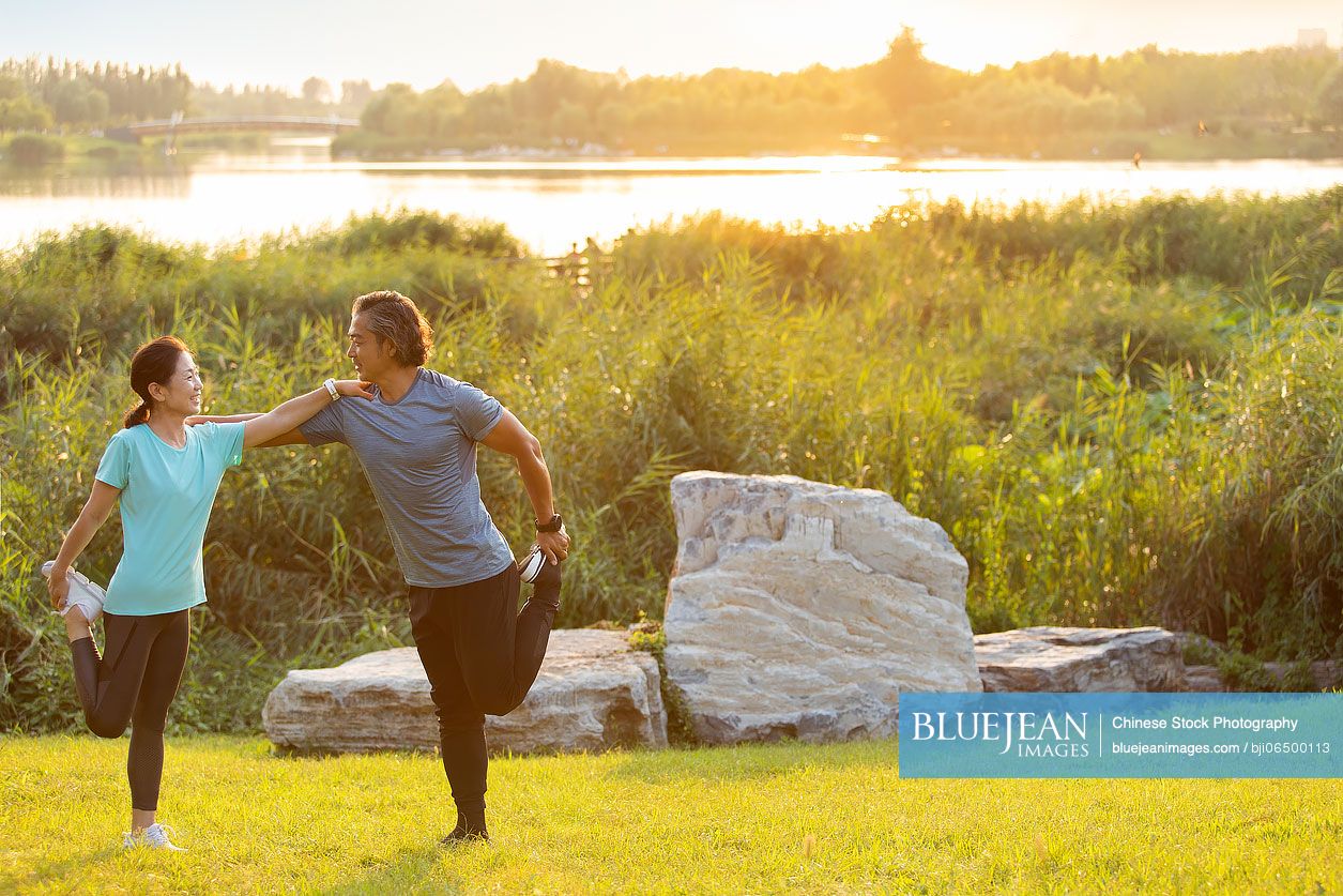 Happy mature Chinese couple exercising in park-High-res stock photo for download