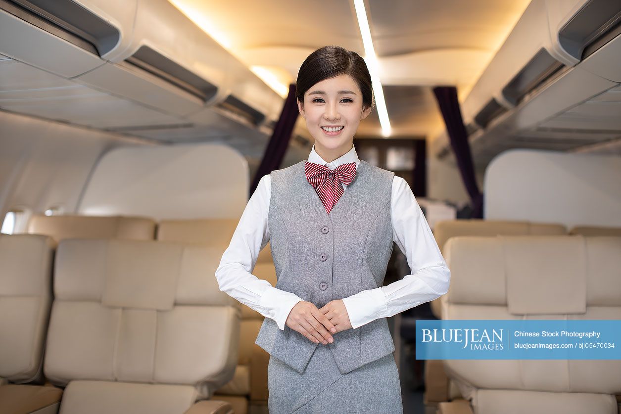 Portrait of smiling Chinese flight attendant-High-res stock photo for ...