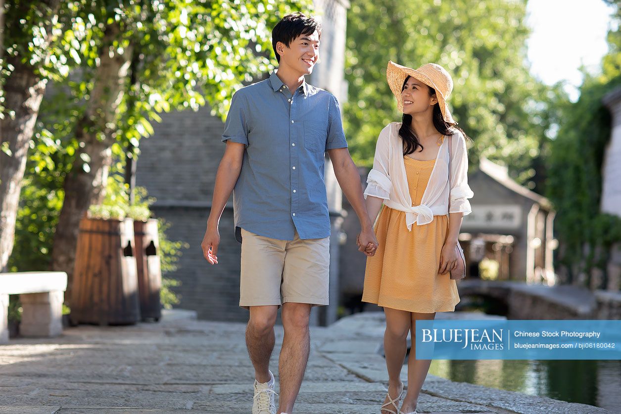 Happy young Chinese couple enjoying vacation-High-res stock photo for download