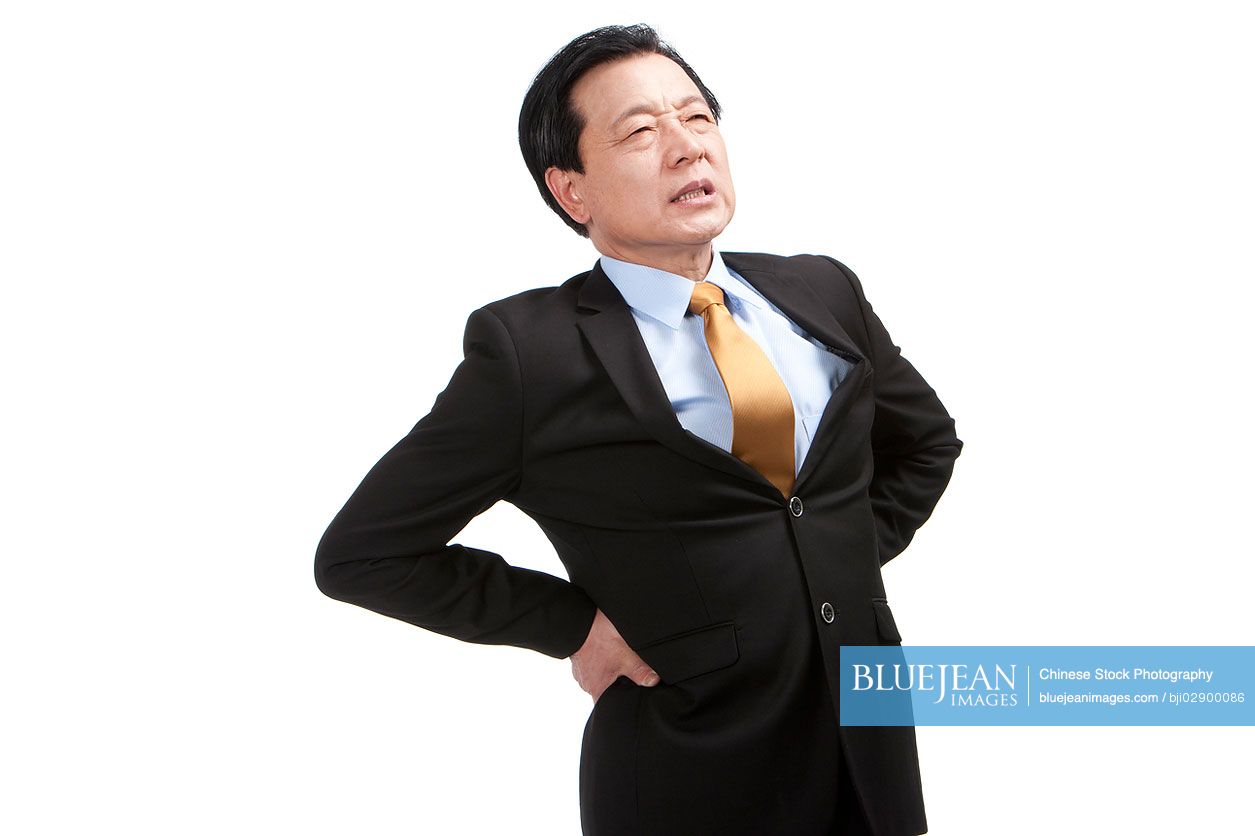 Senior Chinese Businessman Suffering From Low Back Pain High res Stock Senior Chinese Businessman Suffering From Low Back Pain High res Stock