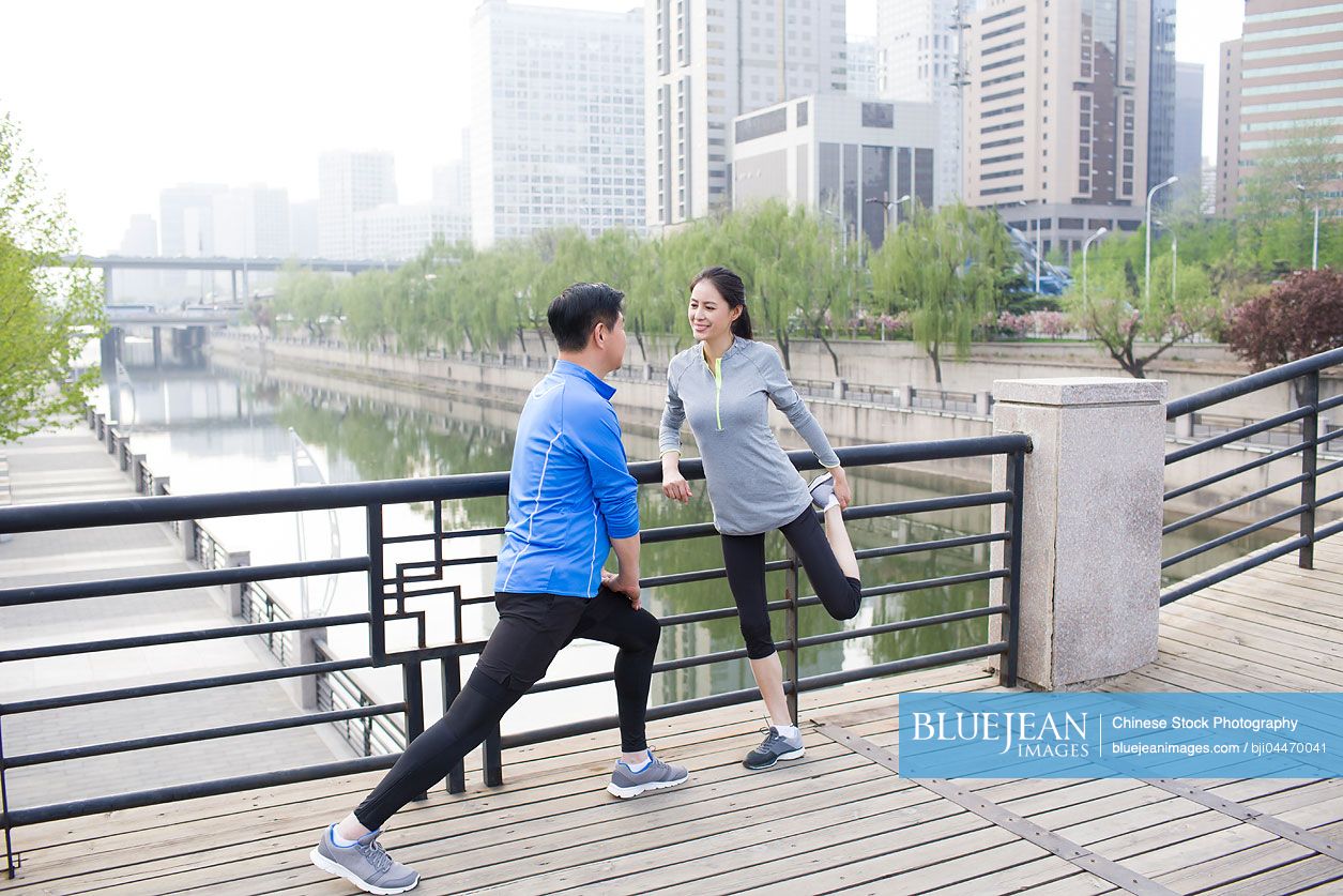Happy mature Chinese couple exercising in park-High-res stock photo for download