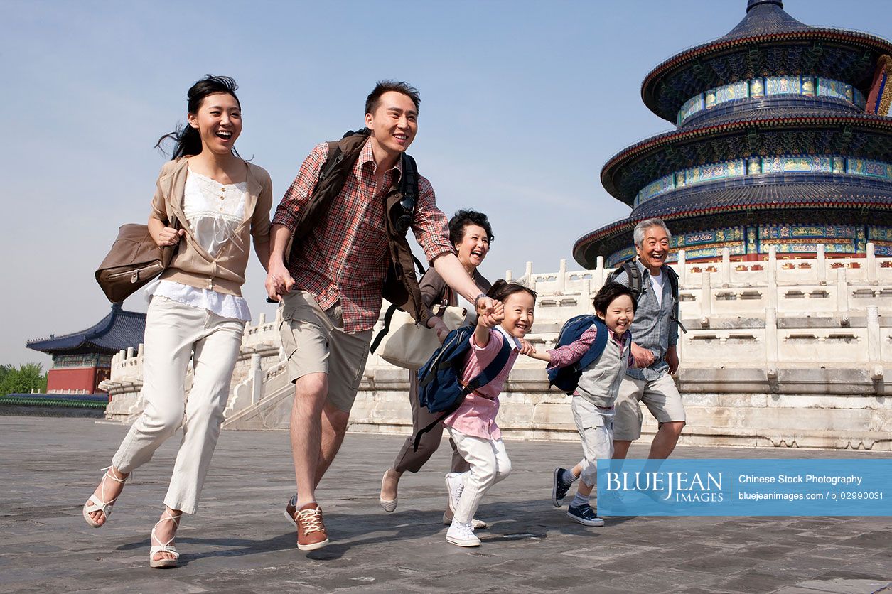 Happy Chinese family travelling at Temple of Heaven in Beijing, China ...